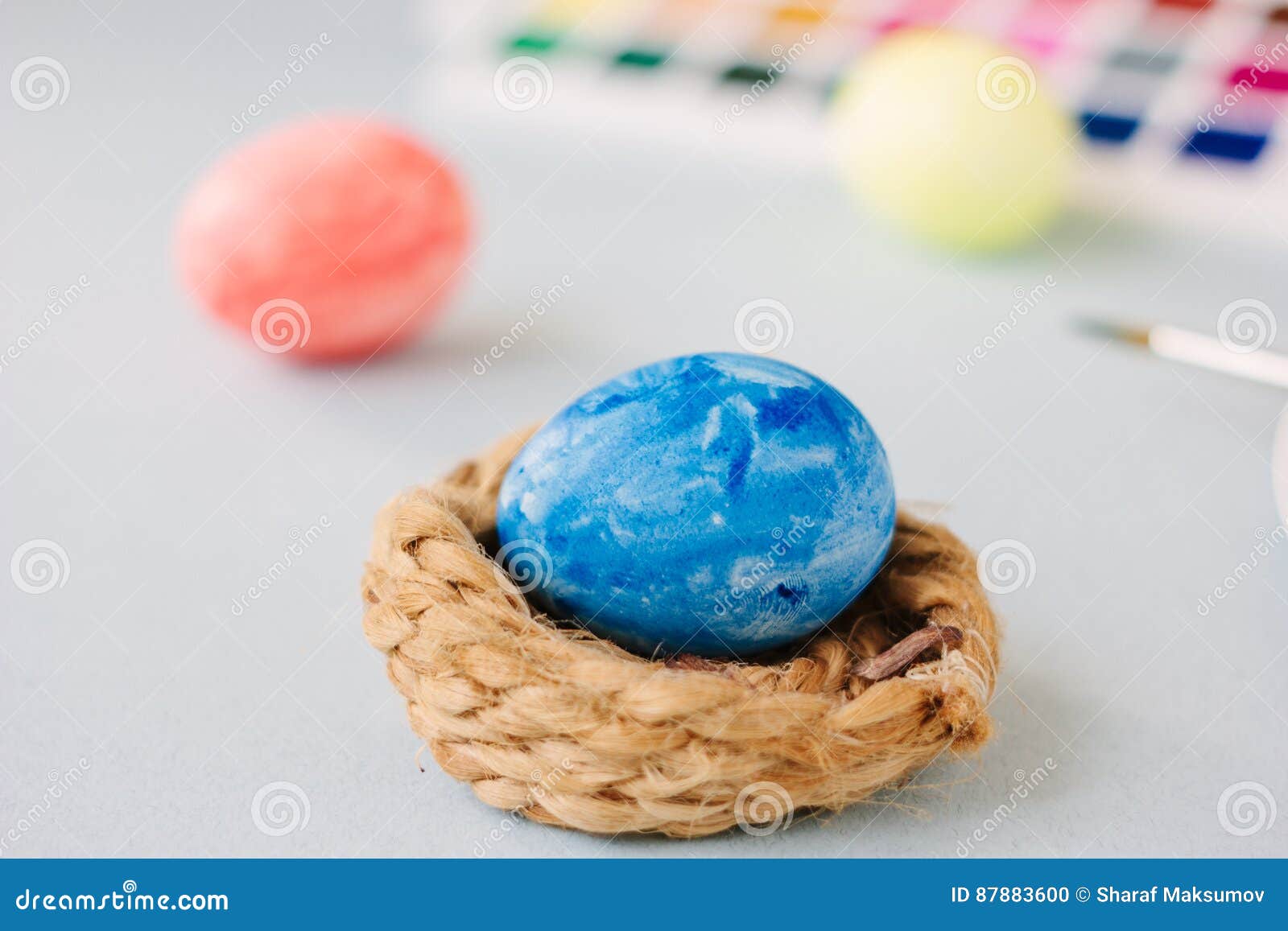 Deep Blue Easter Egg on Nest Over Bright Background. Stock Photo ...