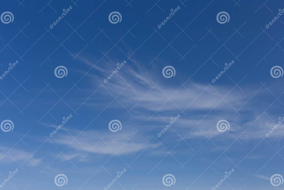 Deep Blue Sky with Wispy White Clouds Stock Image - Image of white ...