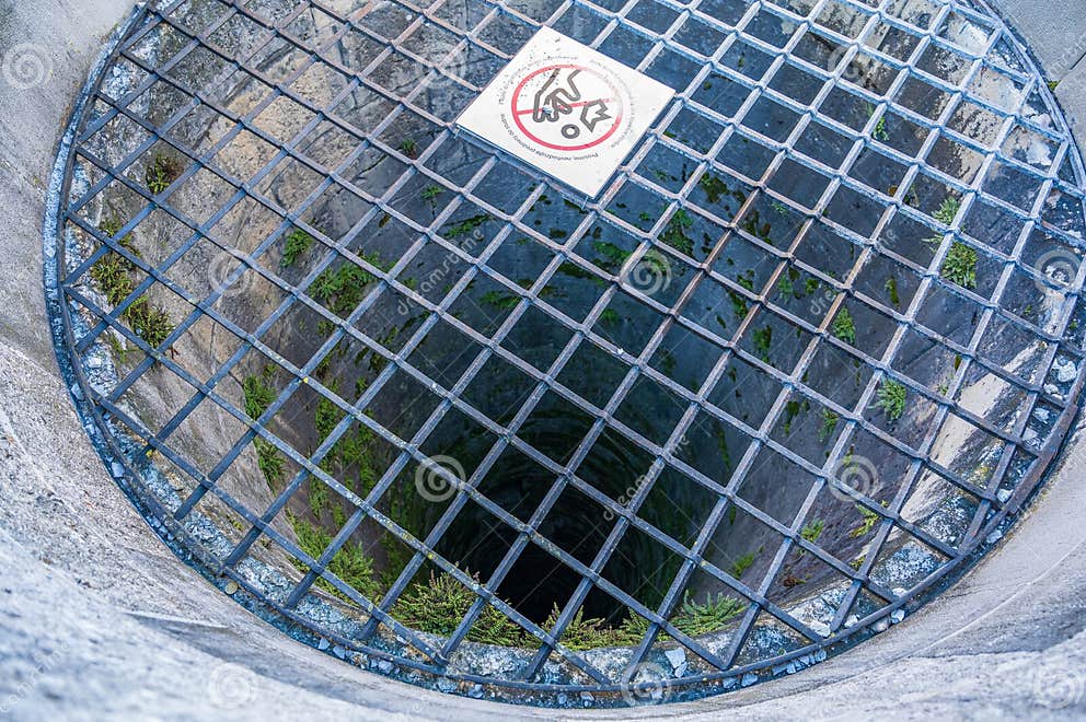 Deep Circular Well Covered with a Metal Grid Stock Image - Image of ...