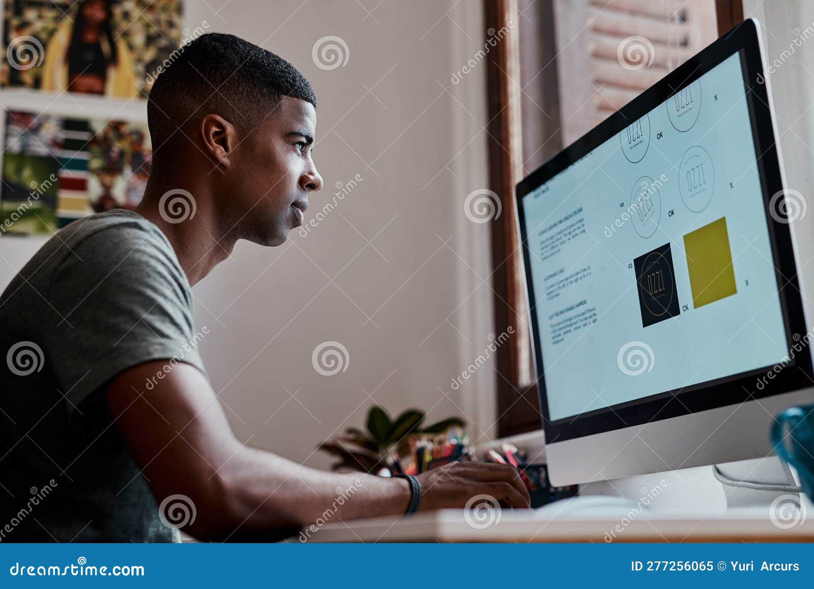 Deep in the Creative Zone. a Young Businessman Using a Computer in a ...