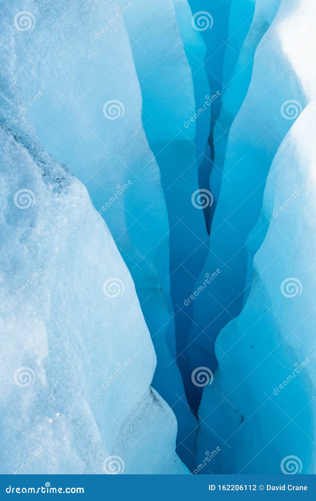 Looking Down into Multi Layered Crevasse of Blue Ice in the Salmon ...