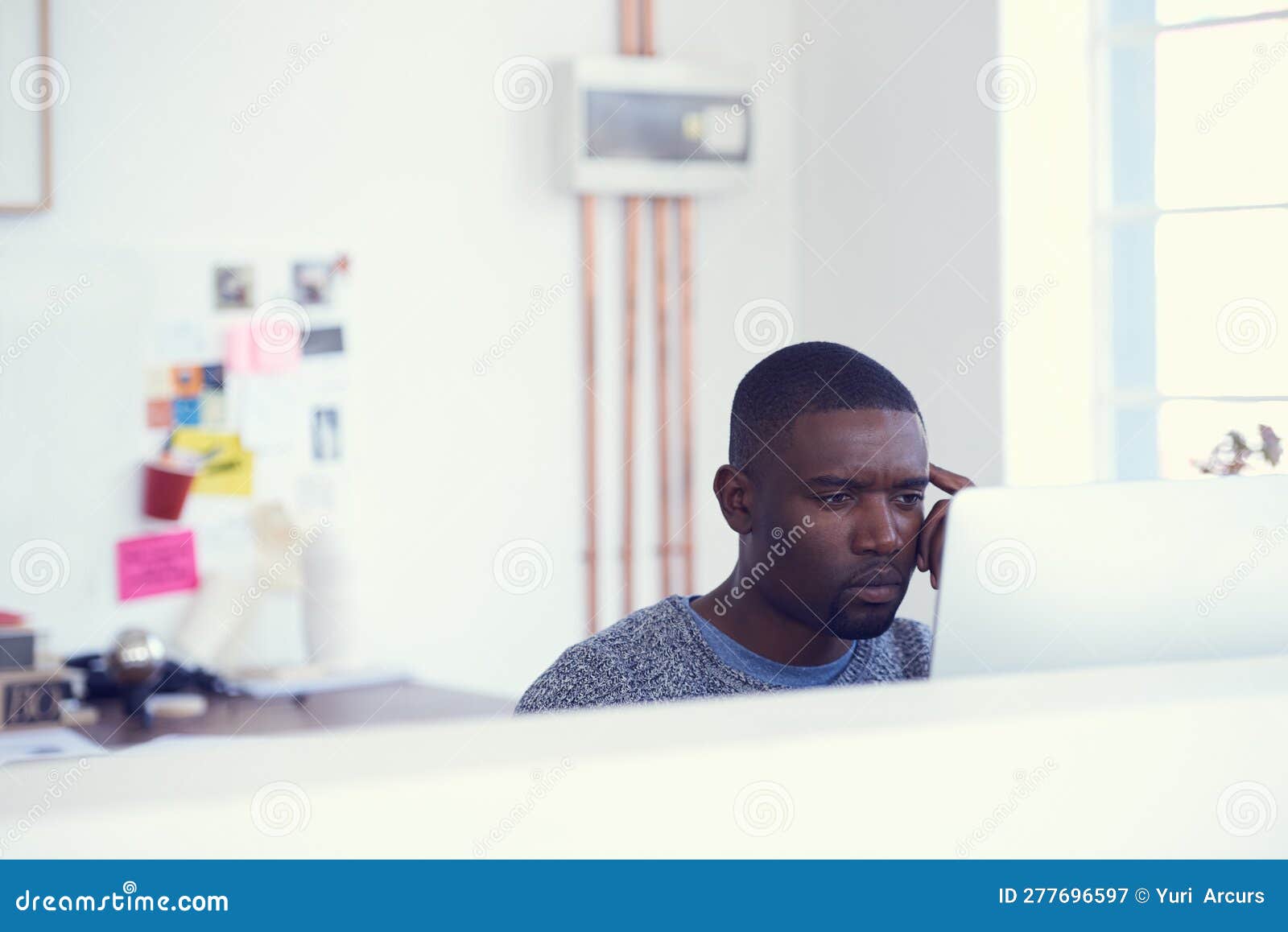 Deep in the Design Zone. a Young Businessman Looking Serious while ...