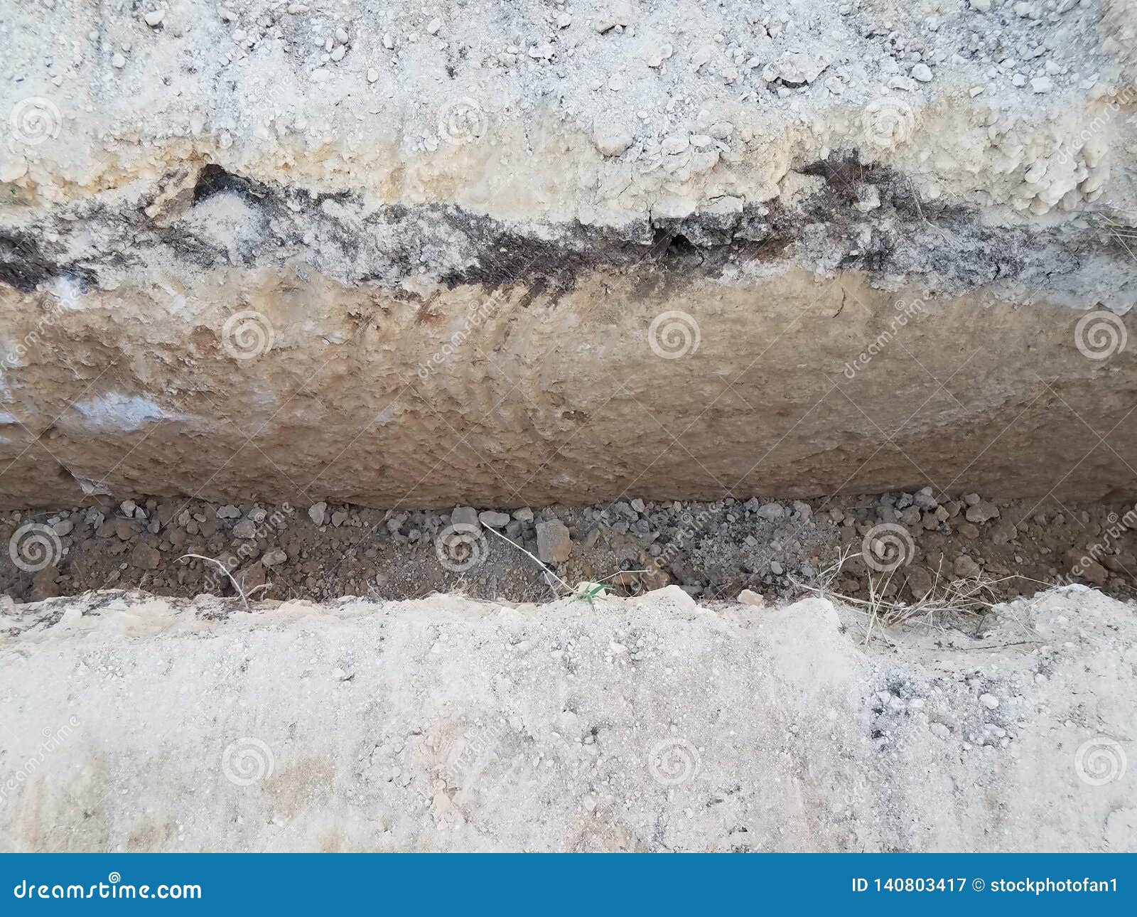 Deep Ditch Dug in Rocks and Dirt and Soil Stock Image - Image of hole ...