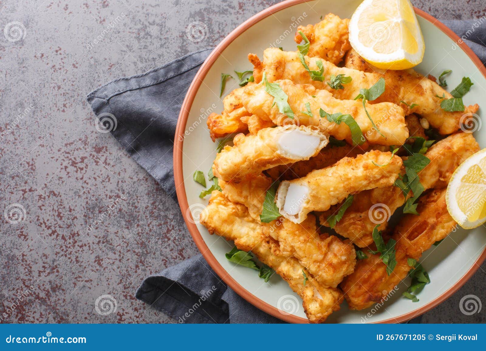 Deep Fried Breaded Calamari Strips with Lemon Closeup on the Plate ...