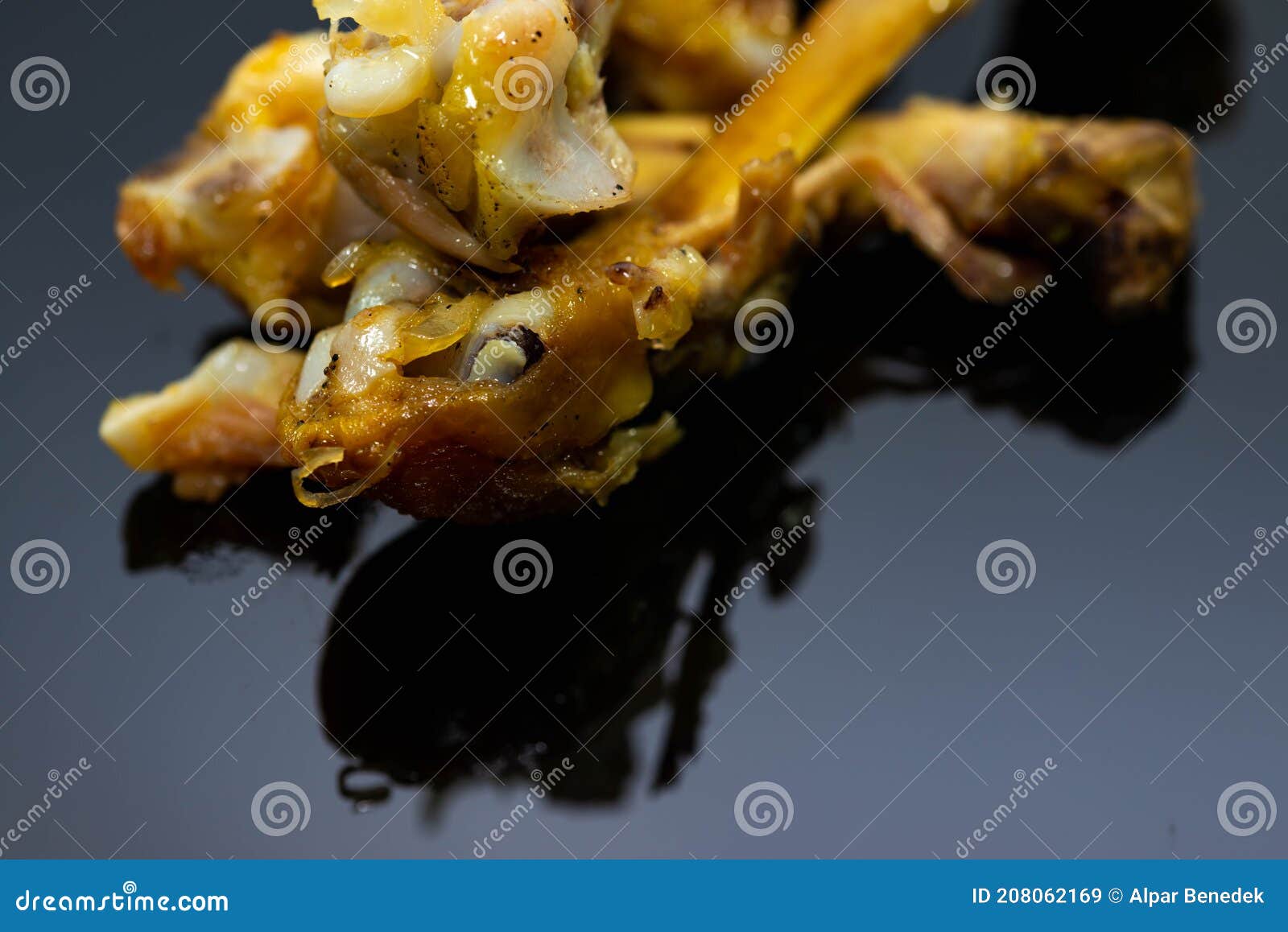 Deep Fried Chicken Bones on Shiny Dark Surface Stock Image - Image of ...