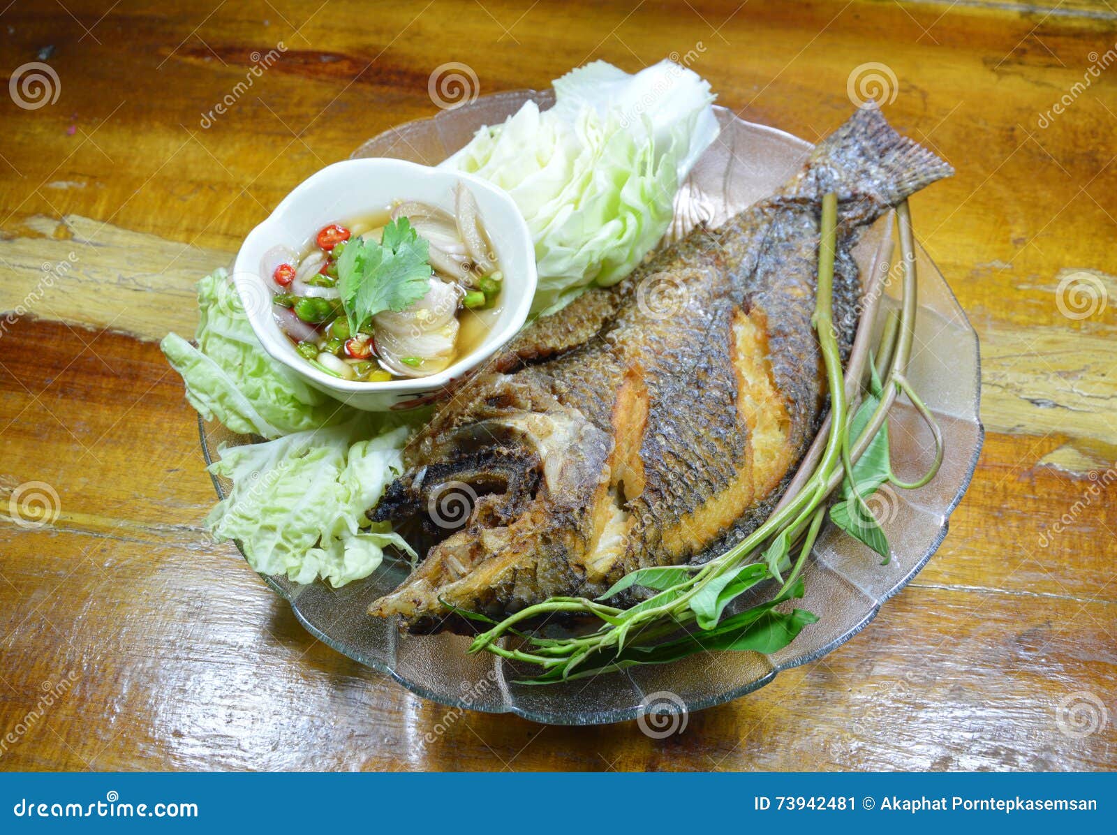 Deep Fried Mango Fish Dipping Chili Fish Sauce and Vegetable on Dish ...
