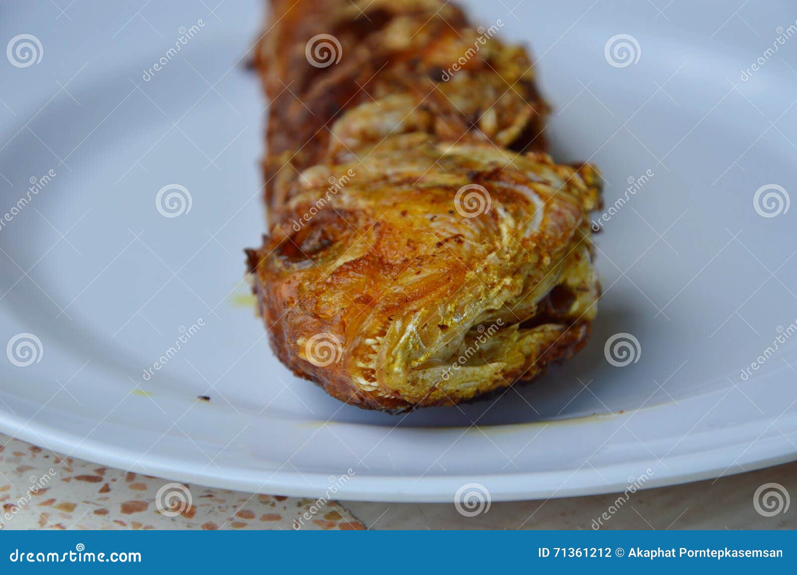 Deep Fried Red Snapper with Turmeric Powder on Plate Stock Photo ...