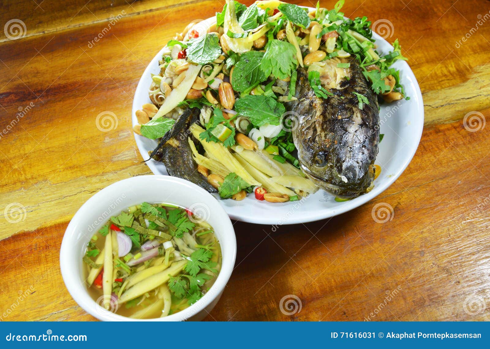 Deep Fried Snake Head Fish with Mixed Herb and Sweet Sauce Stock Image ...