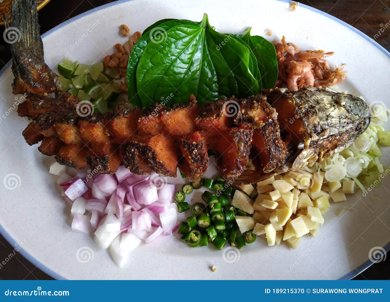 Deep Fried Snake Head Fish on White Oval Plate. Stock Photo - Image of ...