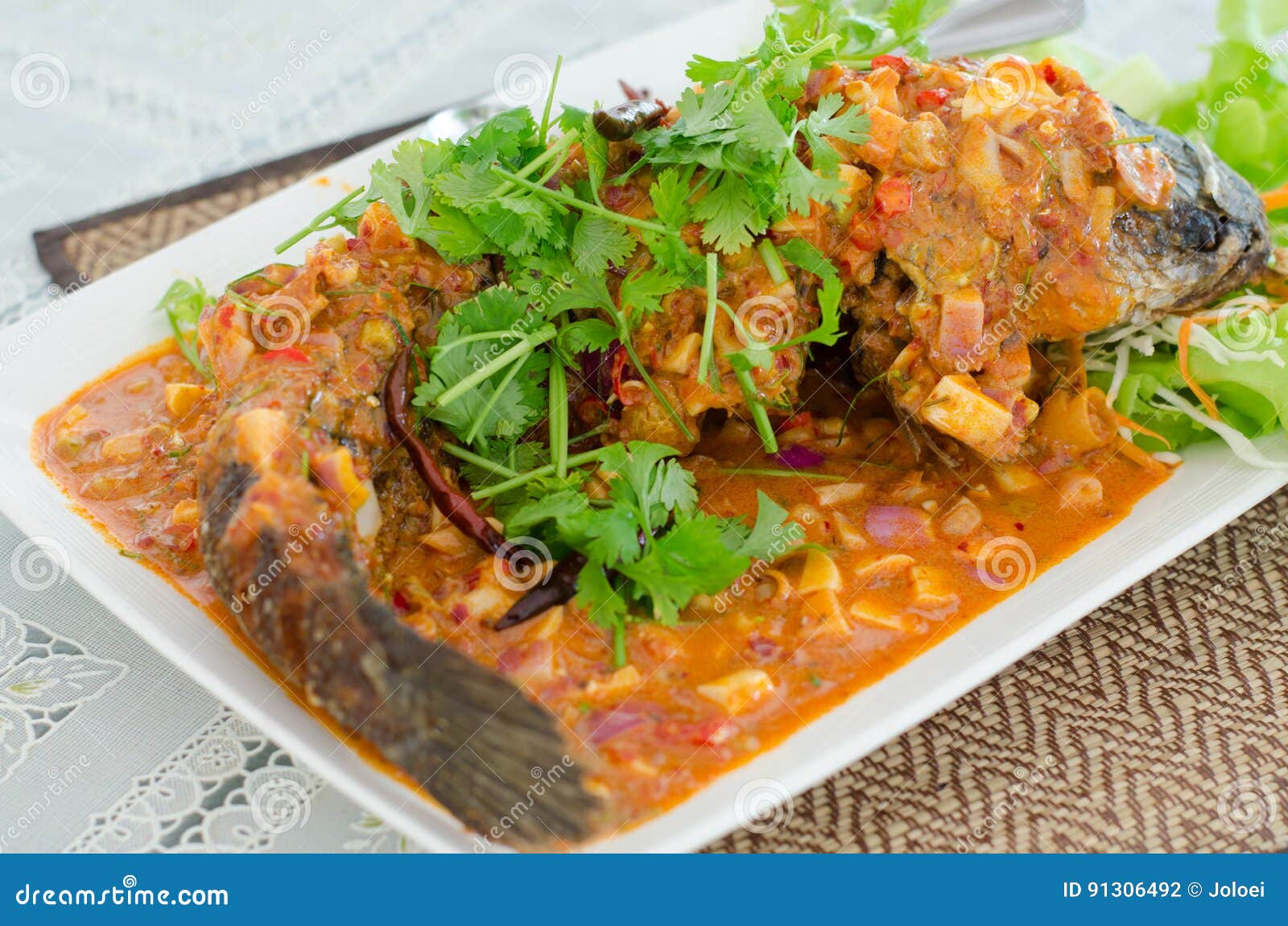 Deep Fried Snakehead Fish with Herb and Spicy Sauce Stock Photo - Image ...