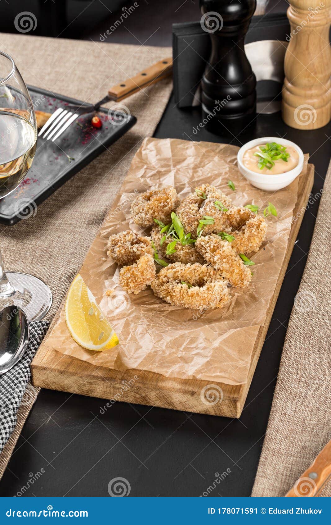 Deep Fried Squid with Sauce and Lemon Slice on the Table at Restaurant ...