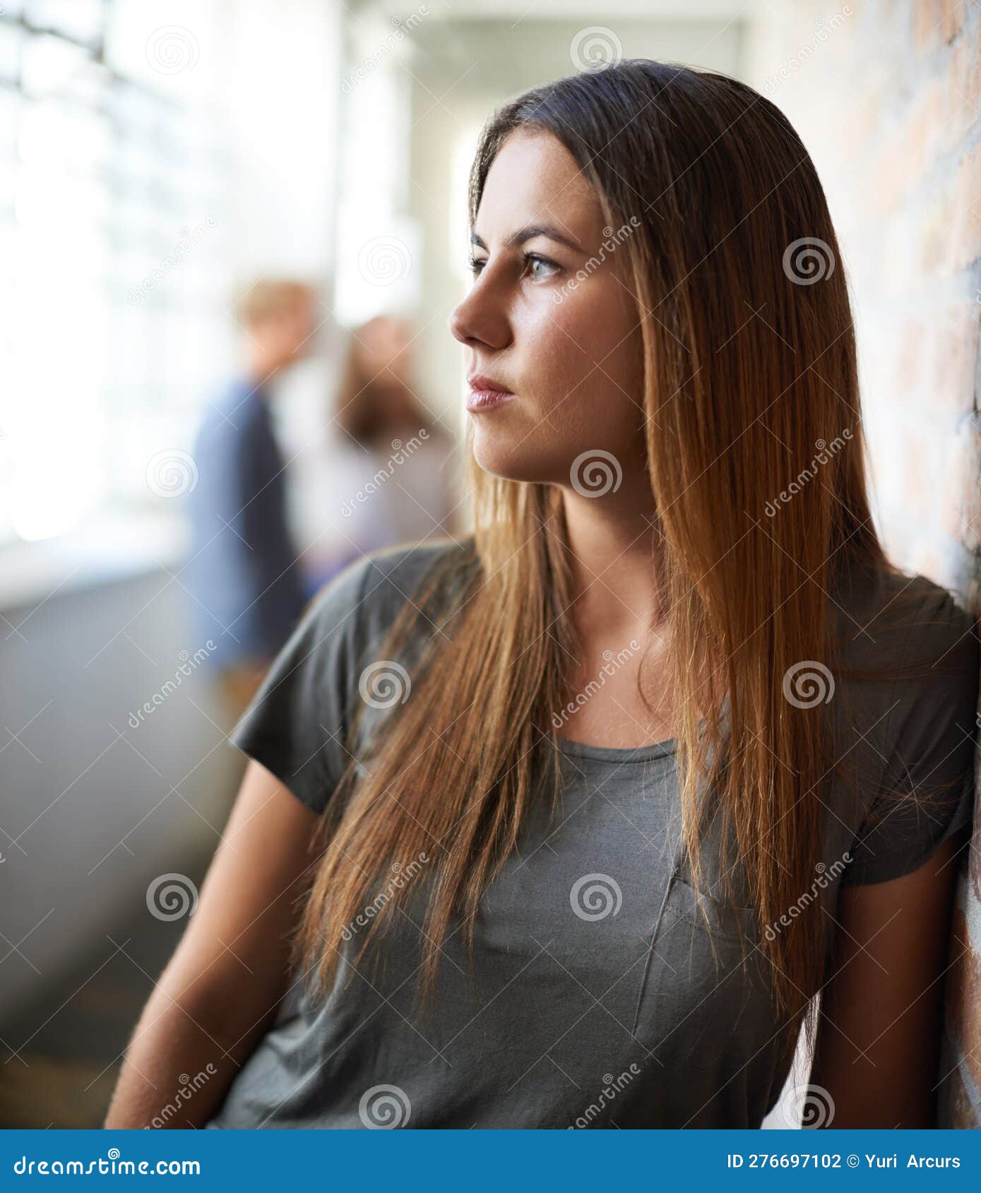 Deep in Thought after Class. an Attractive Young Woman with People in ...