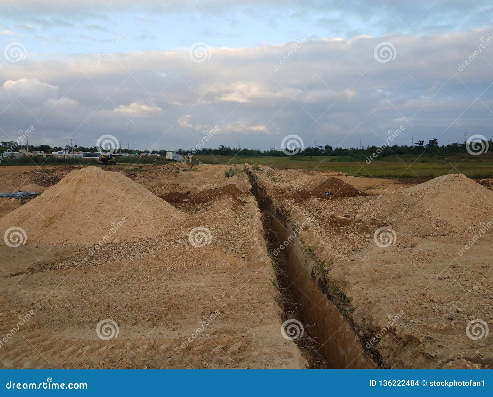 Deep Trench Cut in the Dirt at Construction Site Stock Photo - Image of ...
