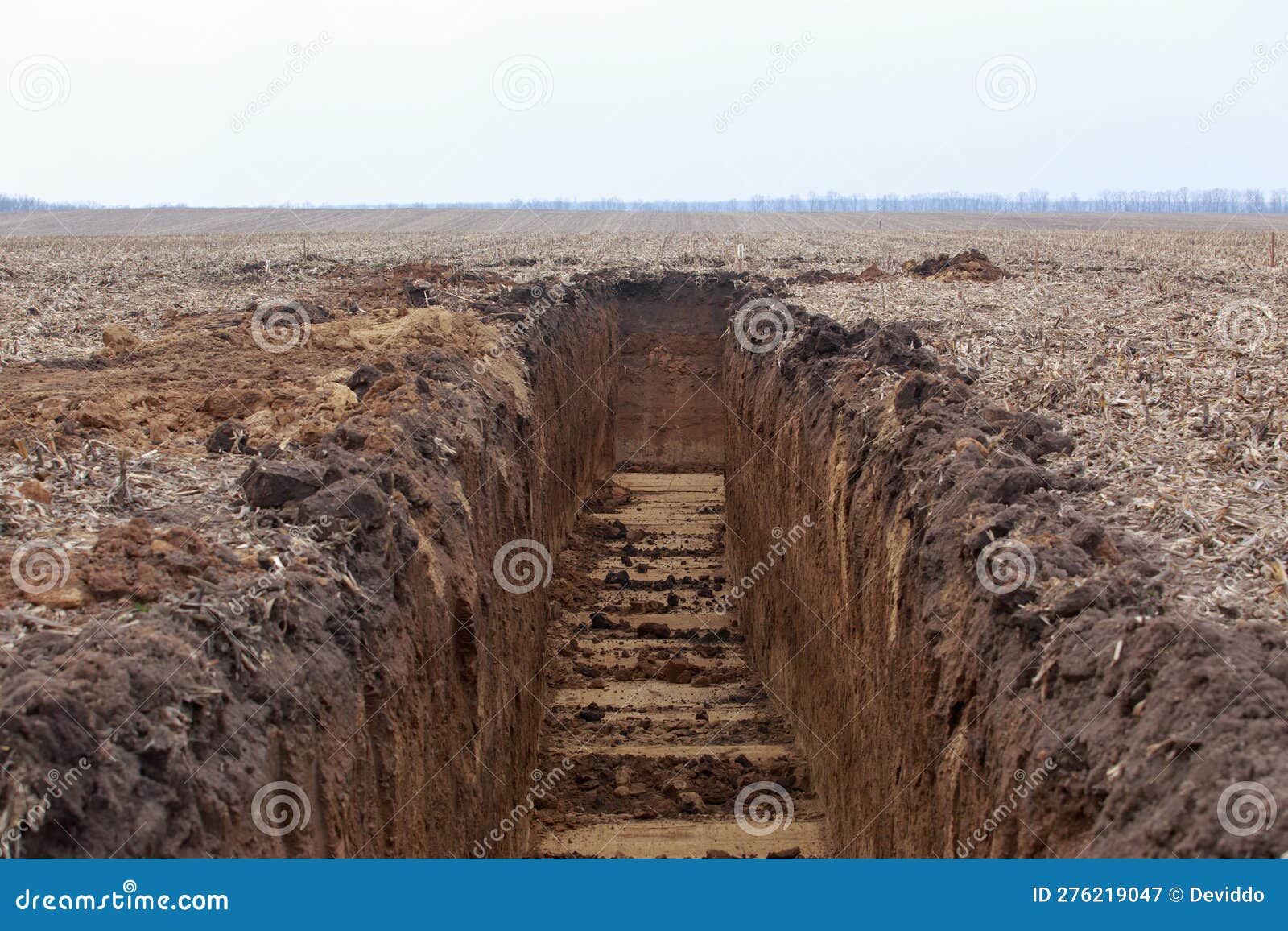 Deep trench in the soil stock image. Image of earthwork - 276219047
