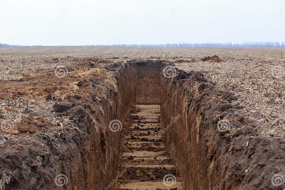 Deep trench in the soil stock image. Image of earthwork - 276219047