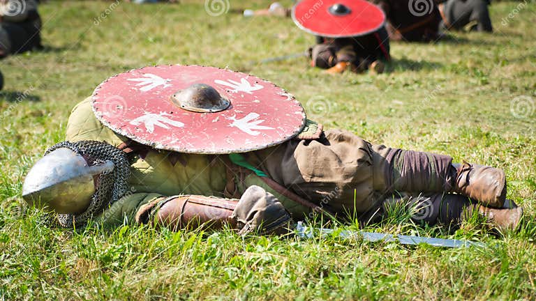 Defeated Warrior Lying Down Stock Image - Image of kneepad, ground ...