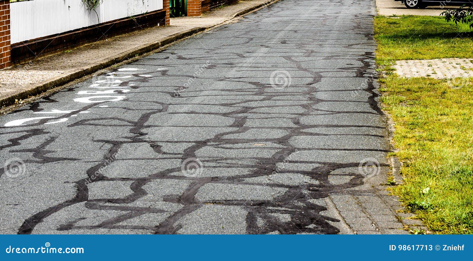 Defective and Constantly Repaired Asphalt on a Village Road Stock Image ...