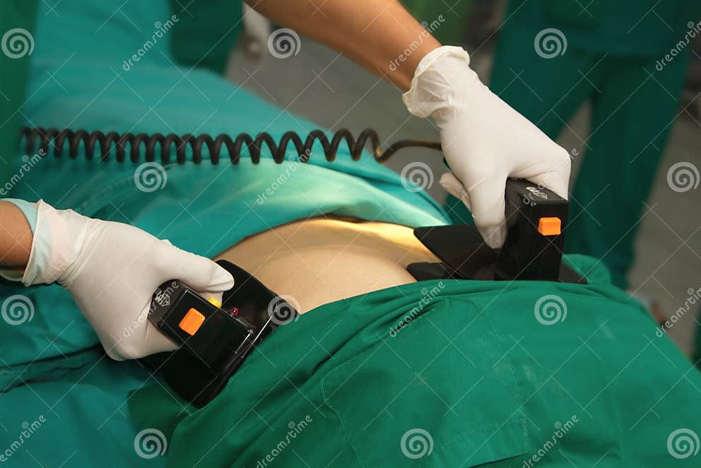 Defibrillator Practice on a CPR Stock Photo - Image of medicine, heart ...