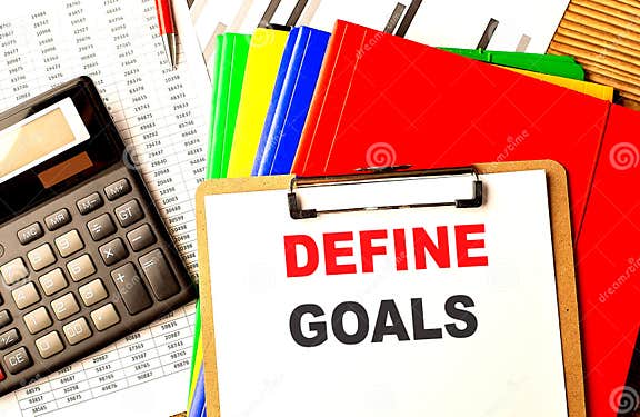DEFINE GOALS Text on Clipboard with Calculator and Color Folder Stock ...