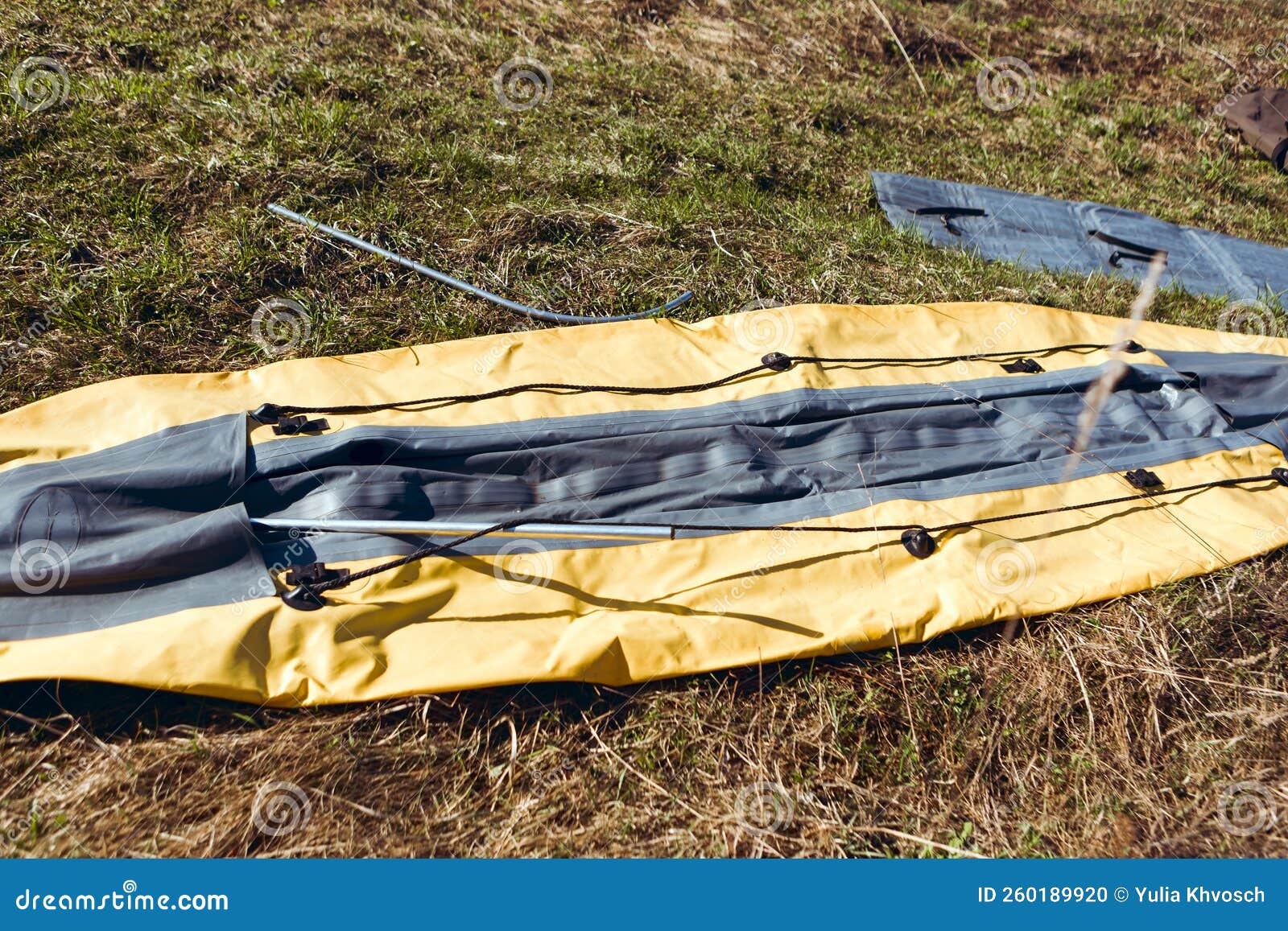Deflated Rubber Boat and a Pump on the Grass. Stock Photo - Image of ...