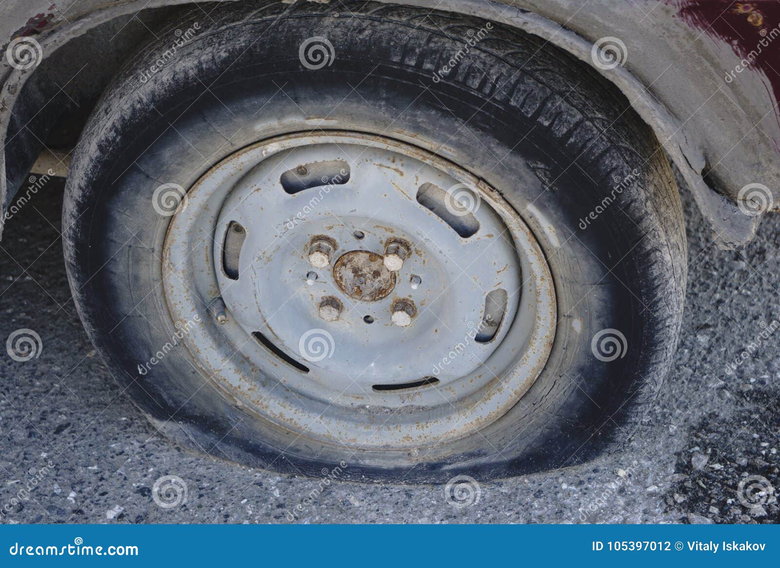 Deflated wheel in the car stock photo. Image of automobile - 105397012