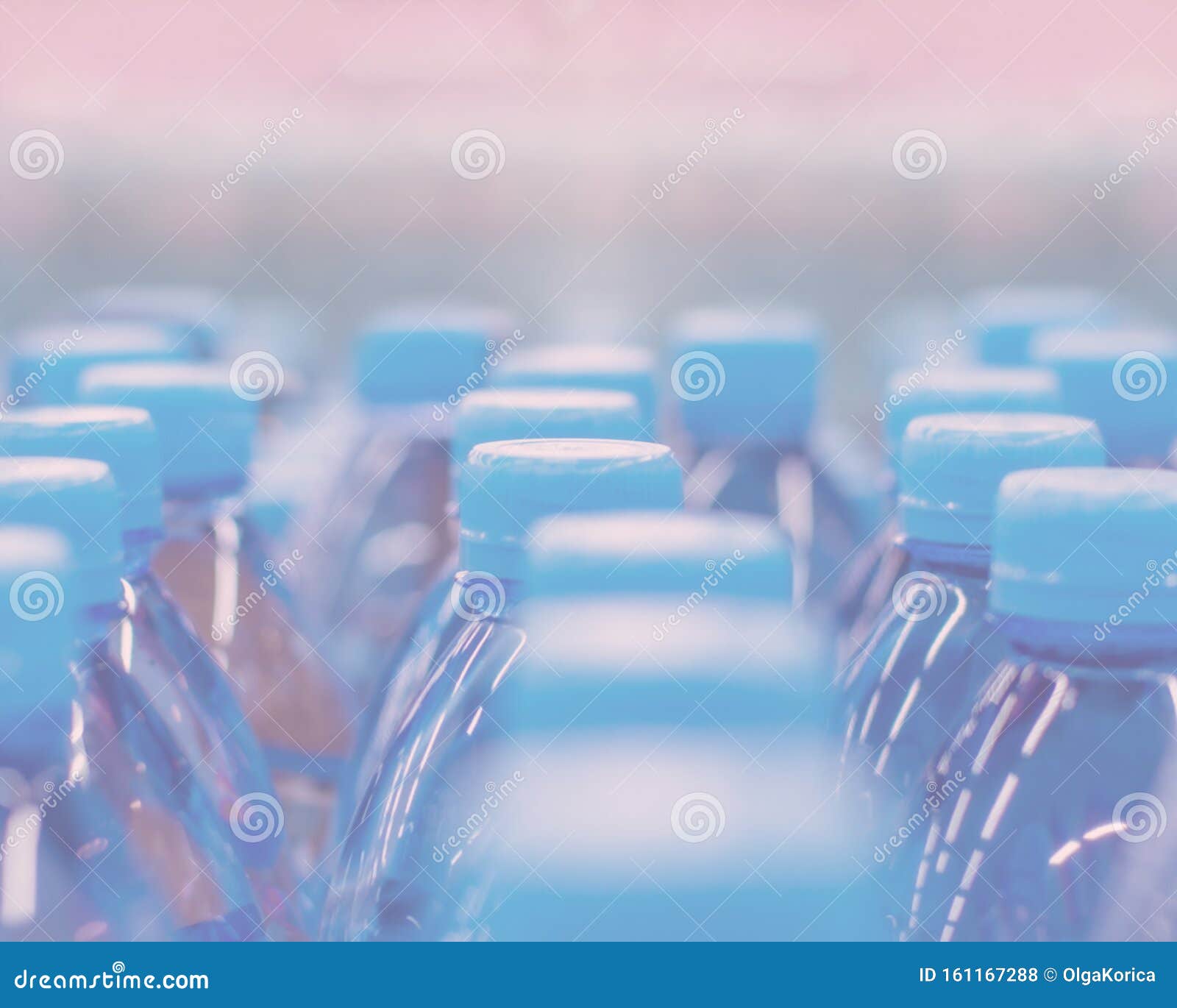 Defocus Background, Blue Caps Set Bottled Water. Pure Drinking Water in ...