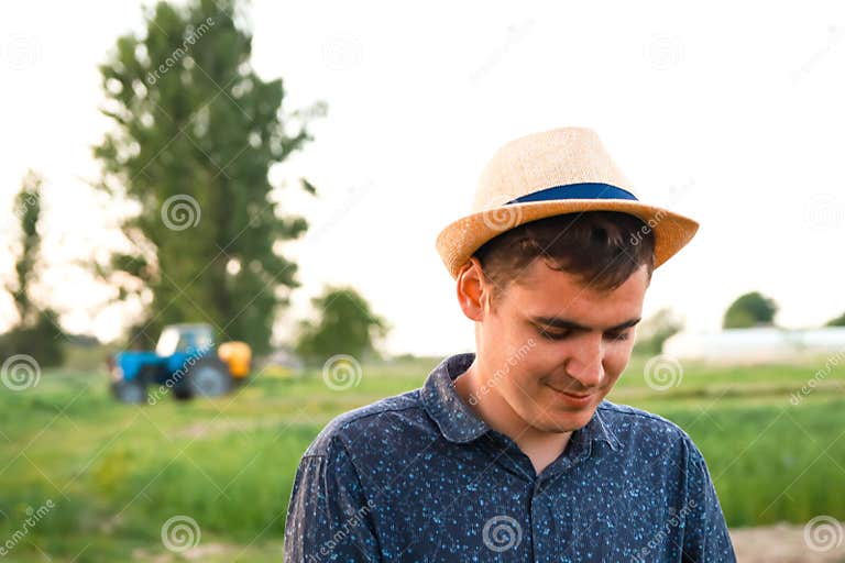 Defocus Farmer in Hat Working on Field with Greenhouse Outdoor ... Defocus Farmer in Hat Working on Field with Greenhouse Outdoor ...