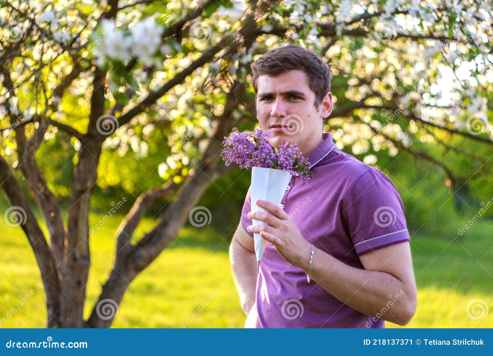 Defocus Portrait of Handsome Caucasian Man with Cone Flowers in Lilac ... Defocus Portrait of Handsome Caucasian Man with Cone Flowers in Lilac ...