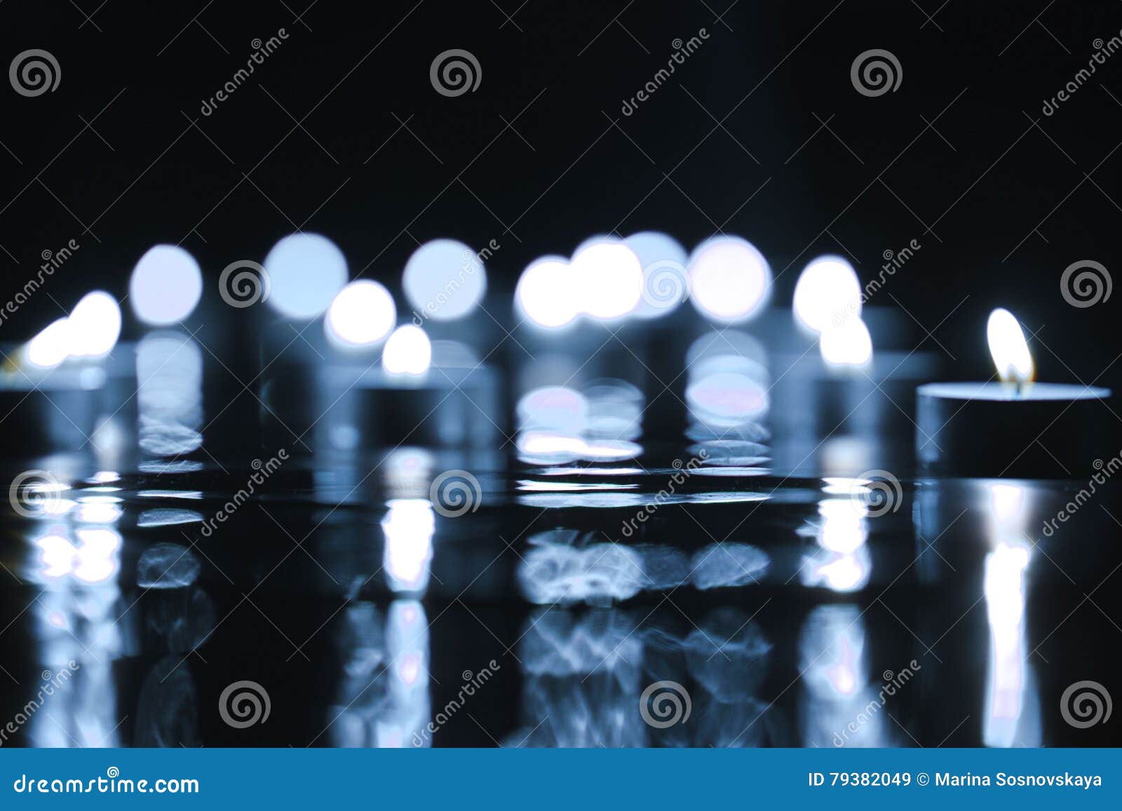 Defocused blue candlelight stock image. Image of candlelight - 79382049
