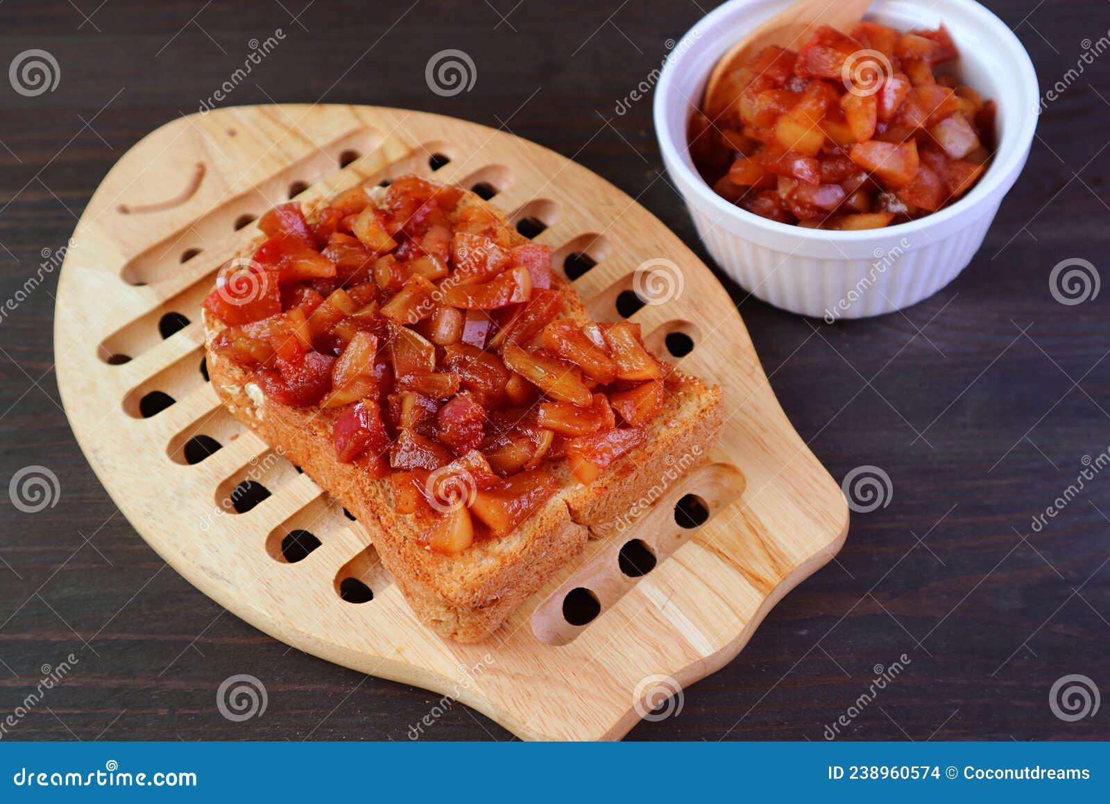 Delectable Toast with Homemade Apple Compote on Wooden Breadboard Stock ...
