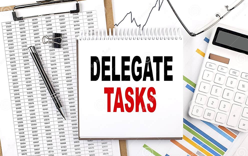 DELEGATE TASKS Text on Notebook with Chart, Calculator and Pen Stock ...
