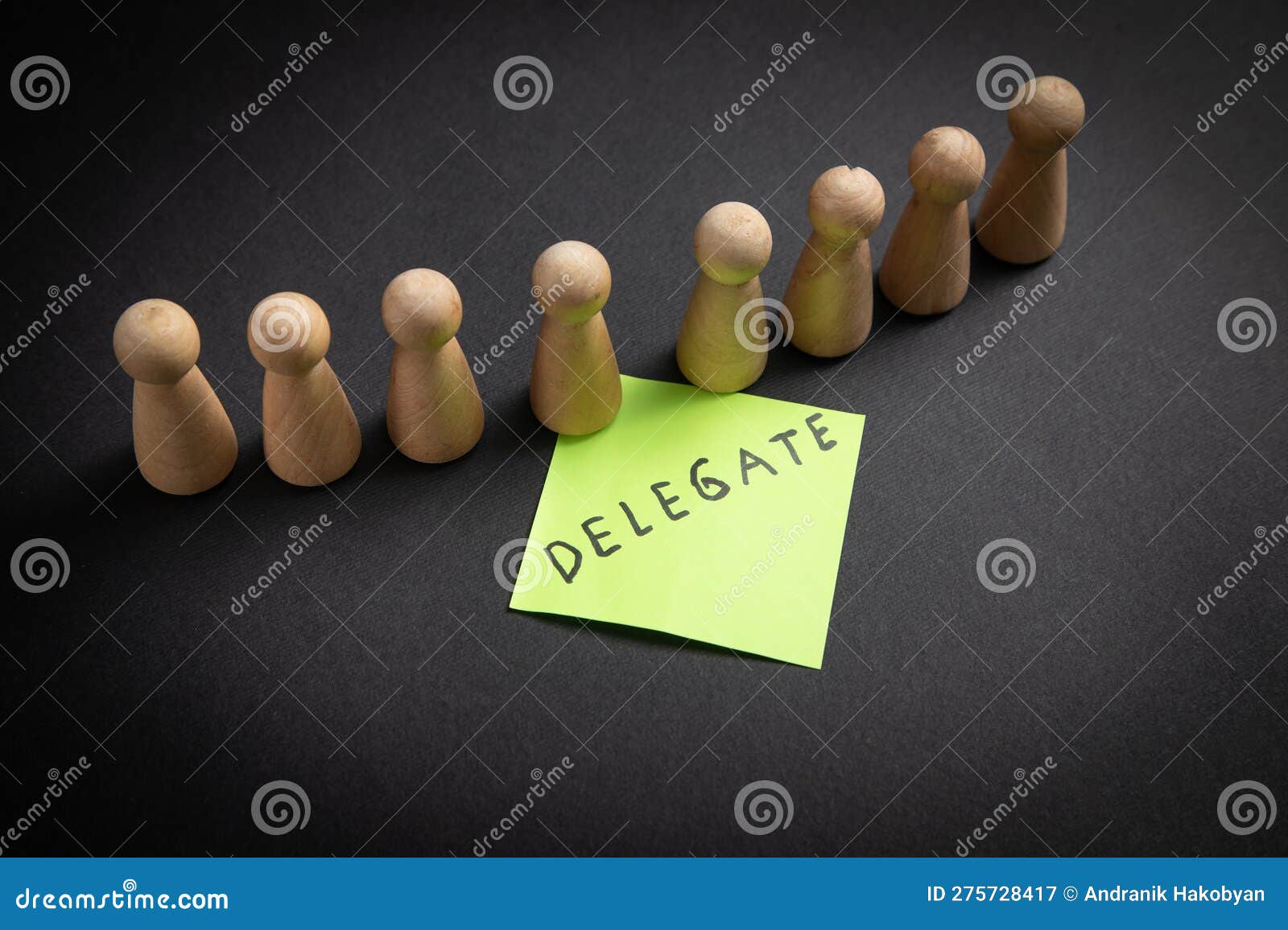 Delegate Word on Sticky Note with a Wooden Human Figures Stock Image ...