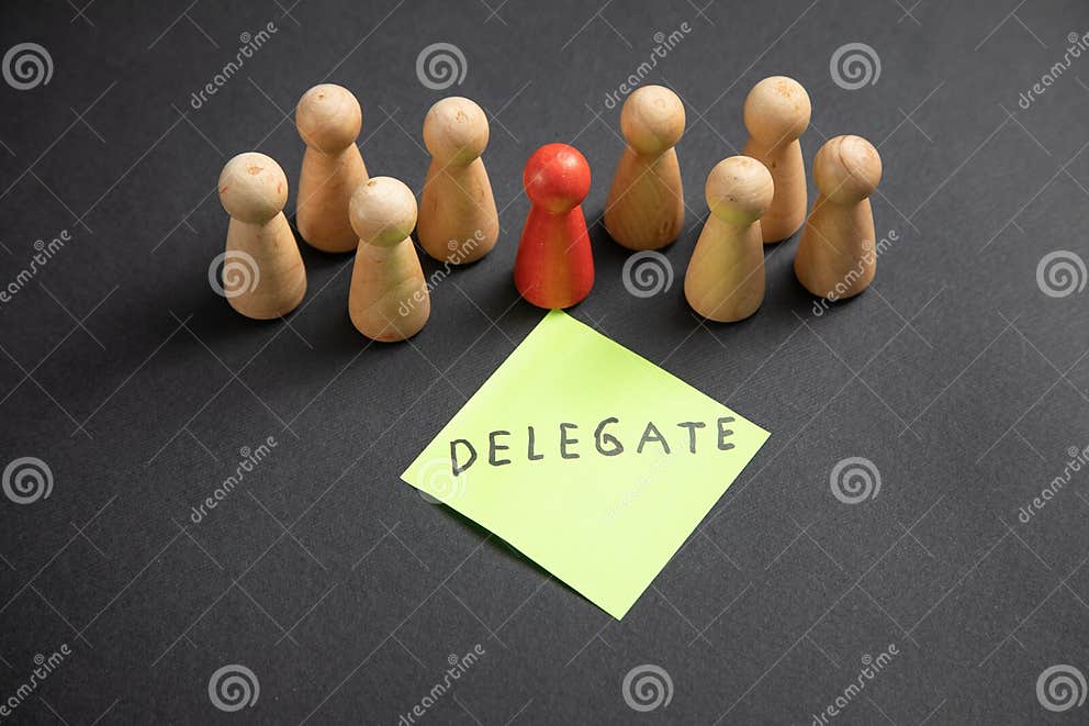 Delegate Word on Sticky Note with a Wooden Human Figures Stock Image ...