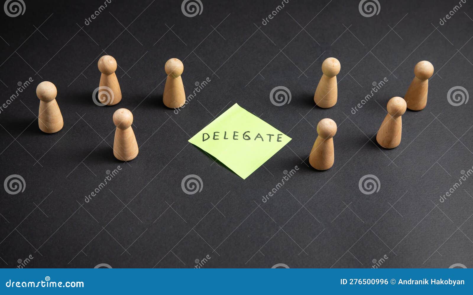 Delegate Word on Sticky Note with a Wooden Human Figures Stock Photo ...