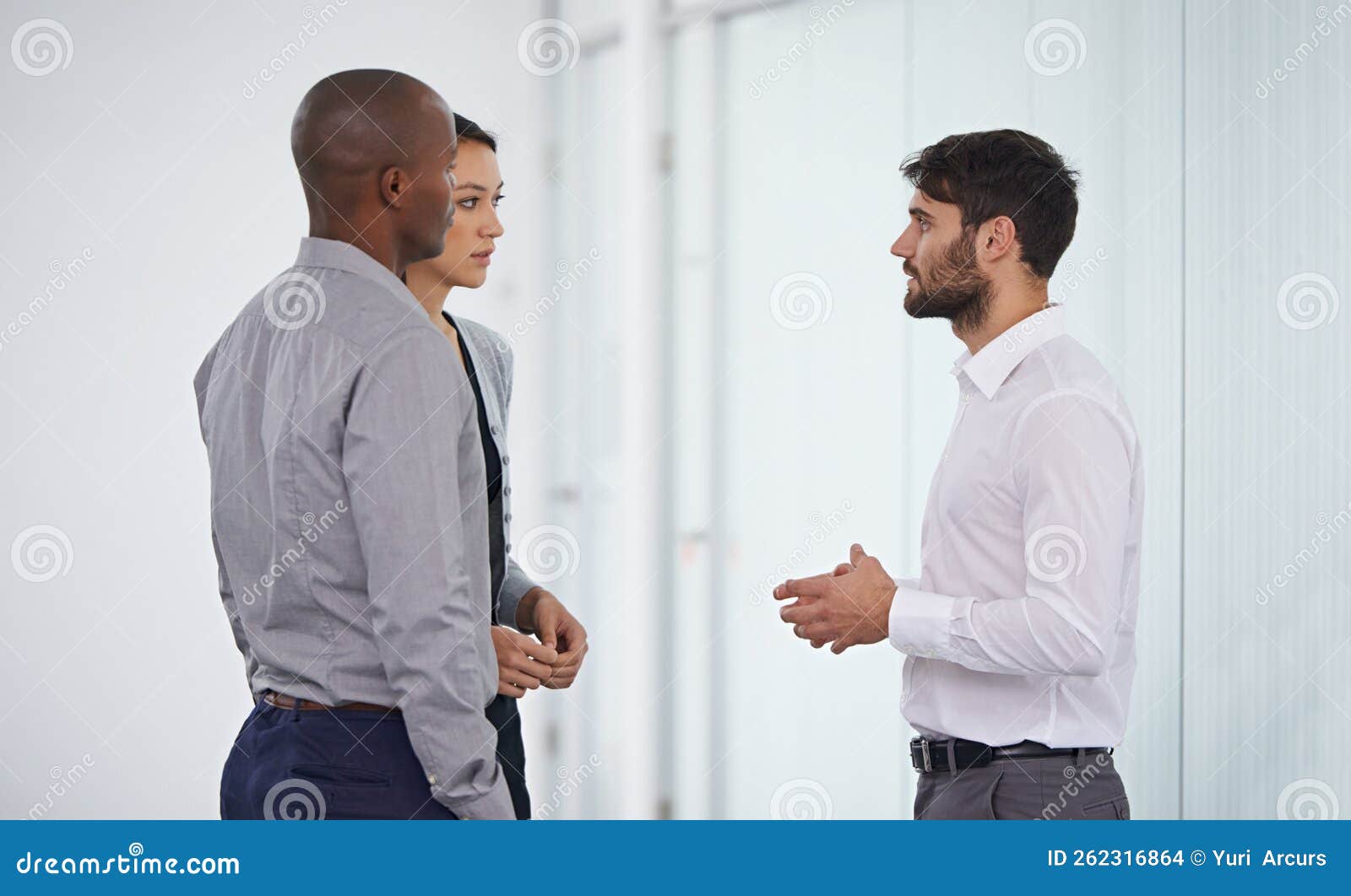 Delegating is What he Does Best. Three Work Colleagues Standing in the ...
