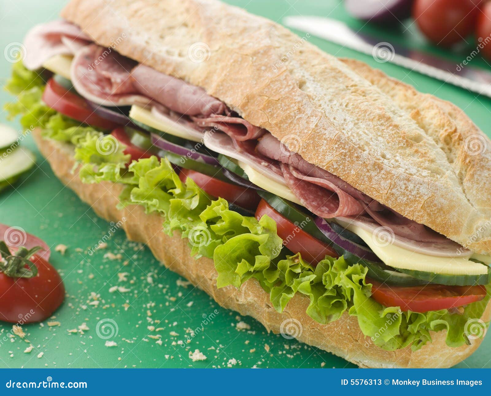 Deli Sub Sandwich on a Chopping Board Stock Image - Image of cucumber ...