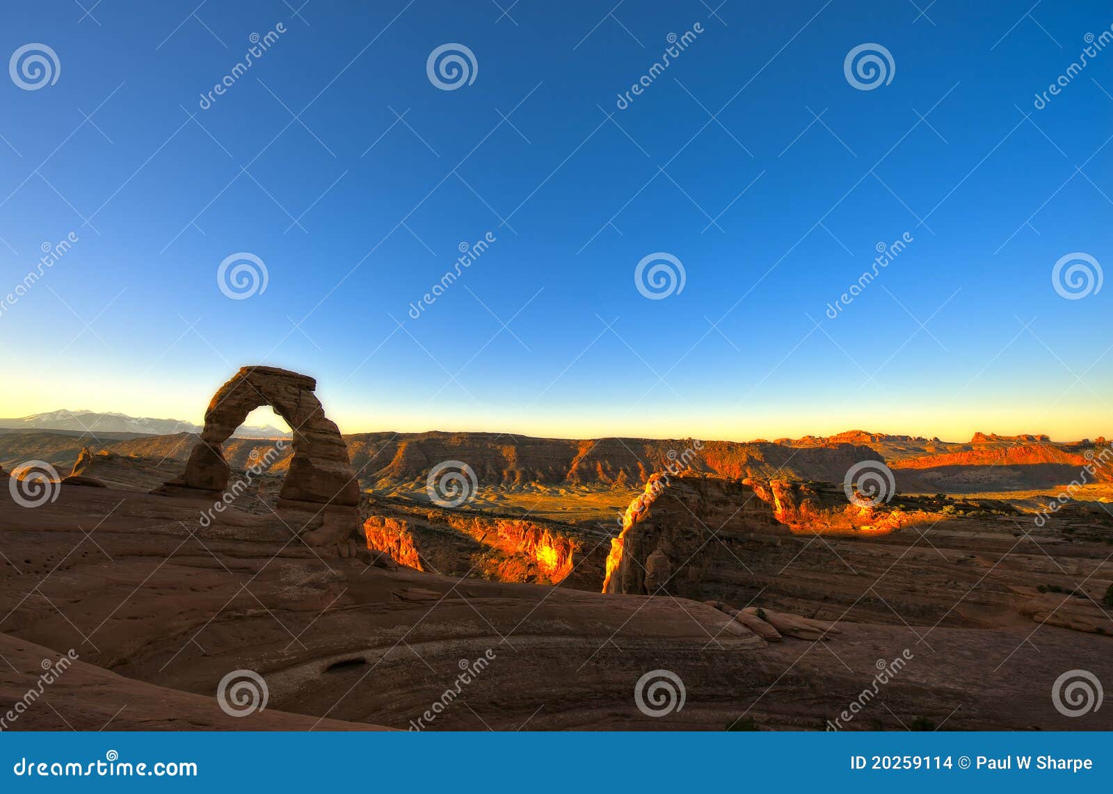 Delicate Arch at Sunrise stock photo. Image of golden - 20259114
