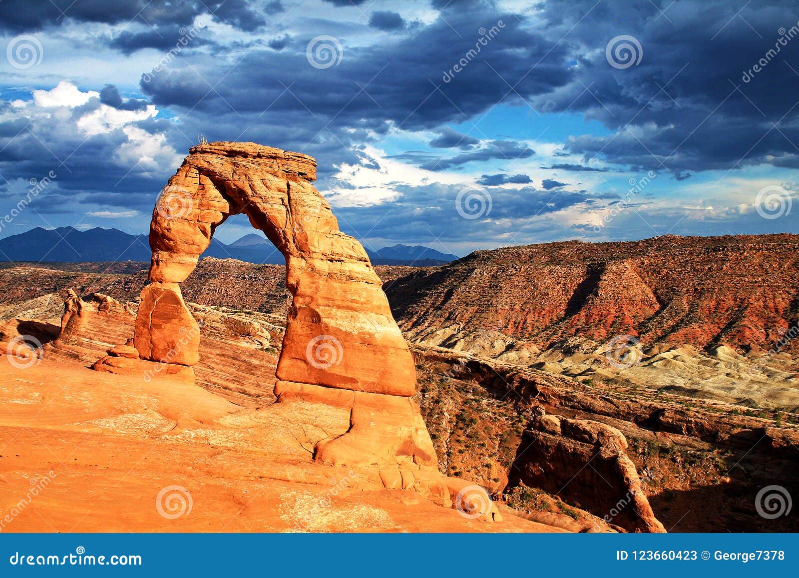 Delicate Arch at Sunset with Dark Dramatic Storm Clouds in Utah Stock ...
