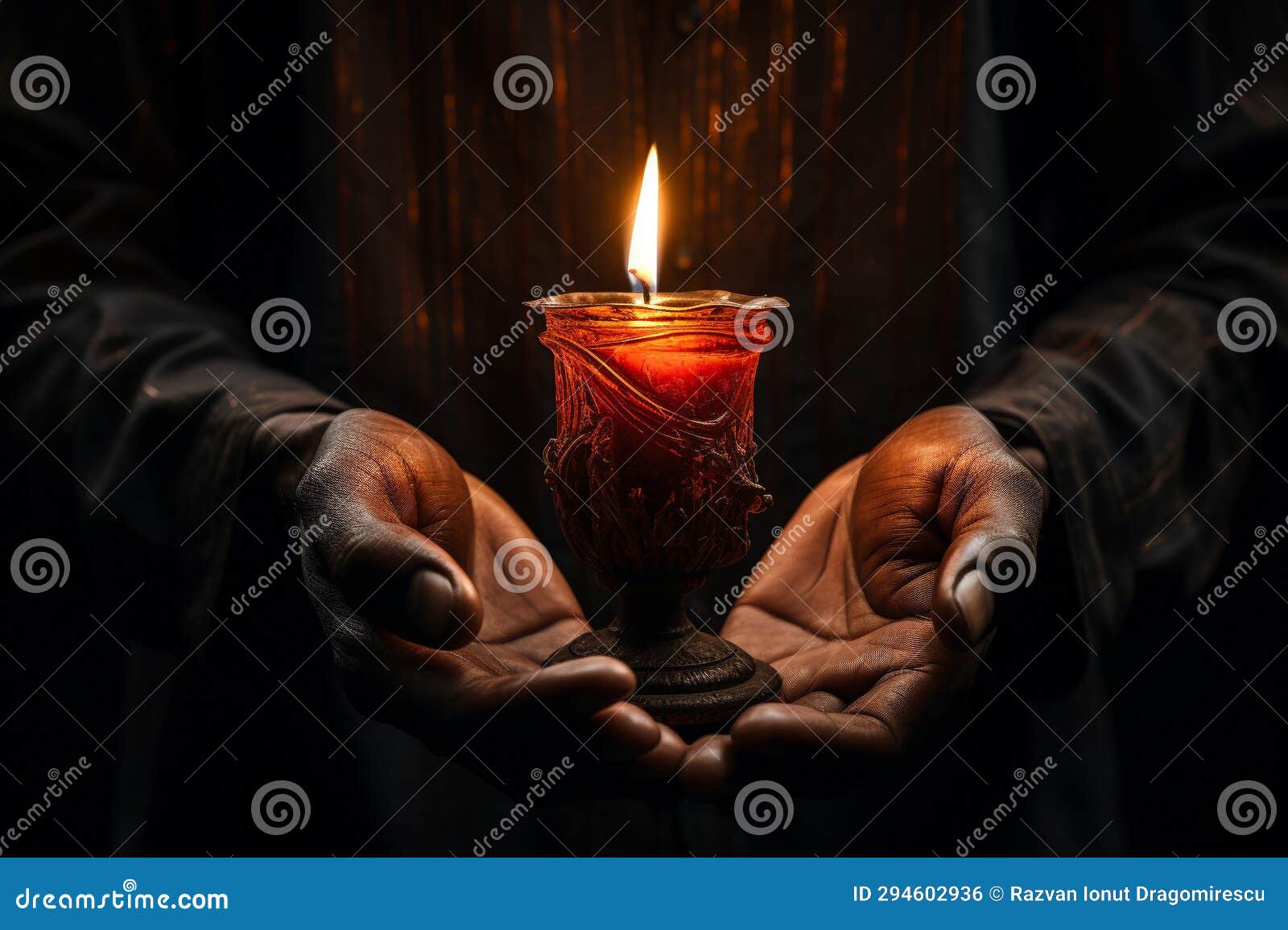 Hands Cradling a Candle, with Its Soft, Warm Glow As the Sole Source of ...