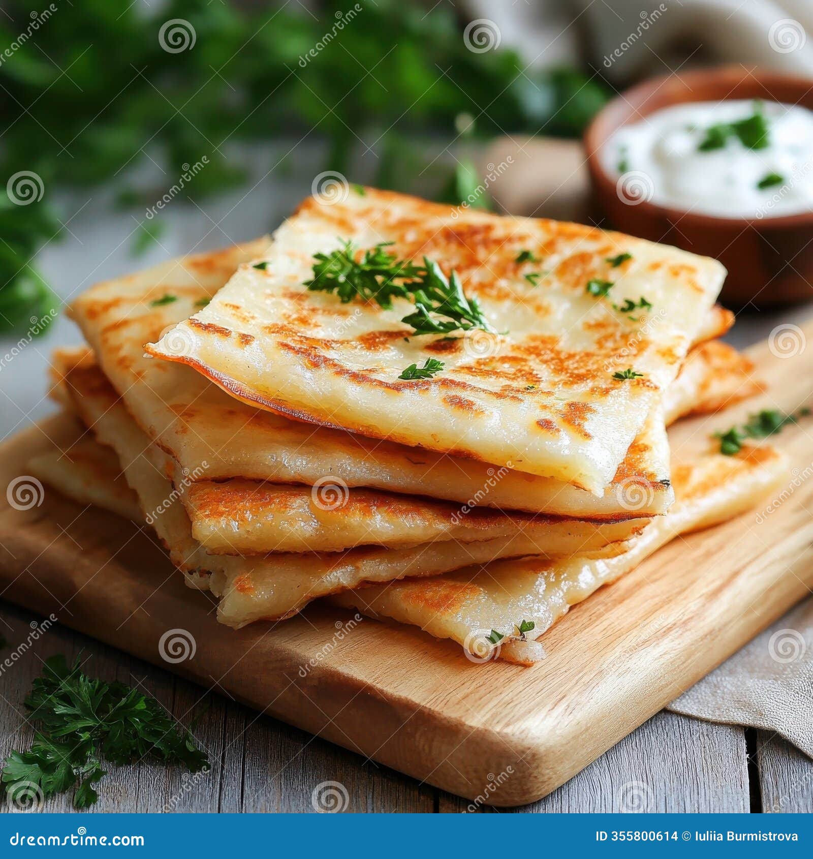 Delicate Layers of Flatbread Served with Creamy Dip in a Rustic Kitchen ...