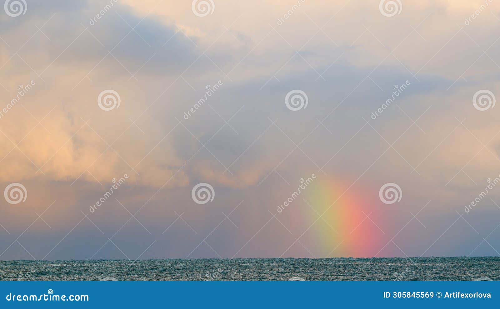 Delicate Rainbow Over the Ocean. Beautiful Rainbow Over the Stormy Sea ...