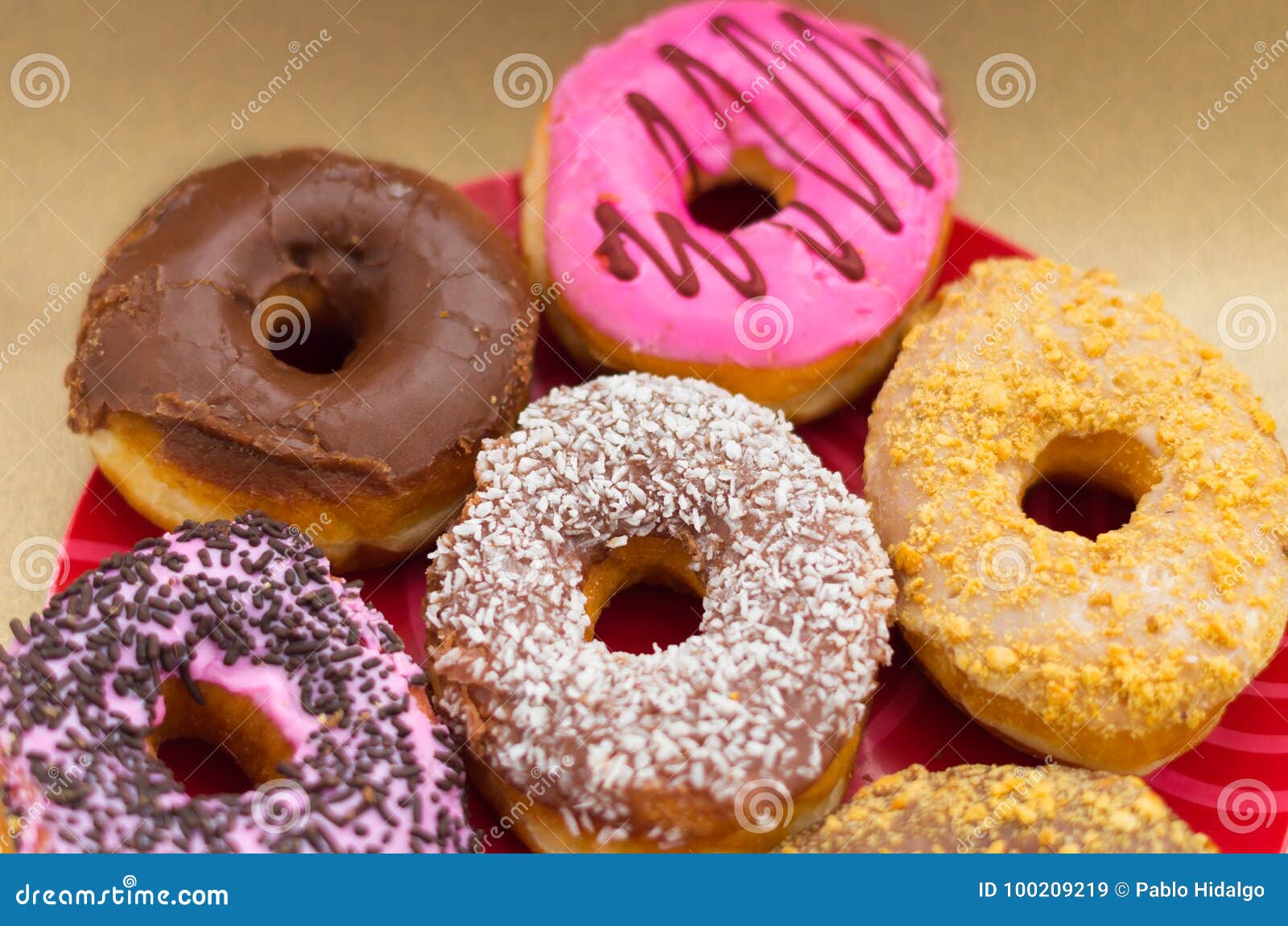 Delicious Assorted Donuts of Different Glazed Over a Red Plate in a ...