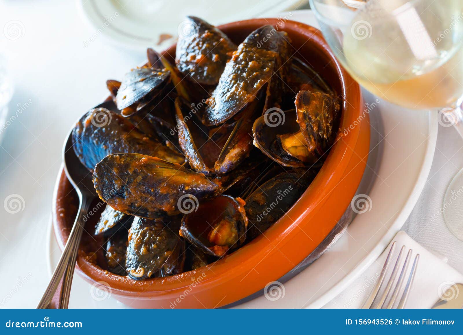 Delicious Baked Mussels on a Bowl with Spoon at Table Stock Photo ...