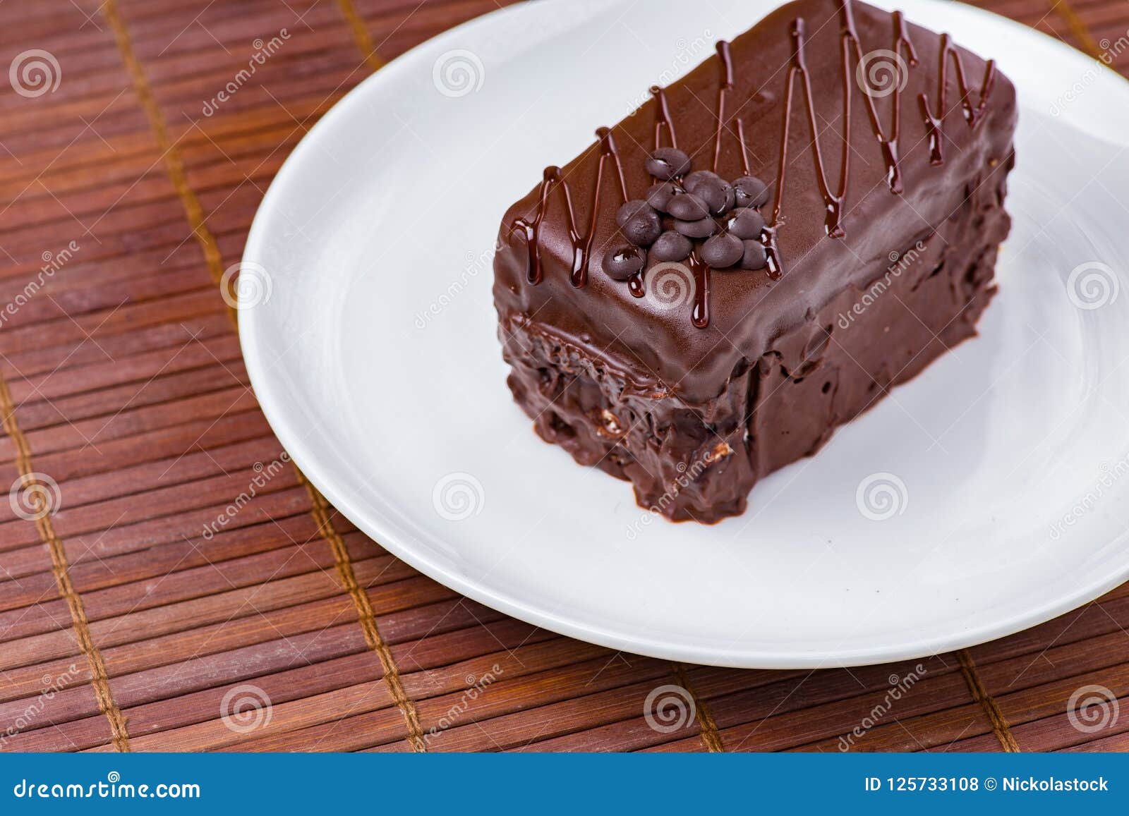 Chocolate cake on plate stock photo. Image of dessert - 125733108
