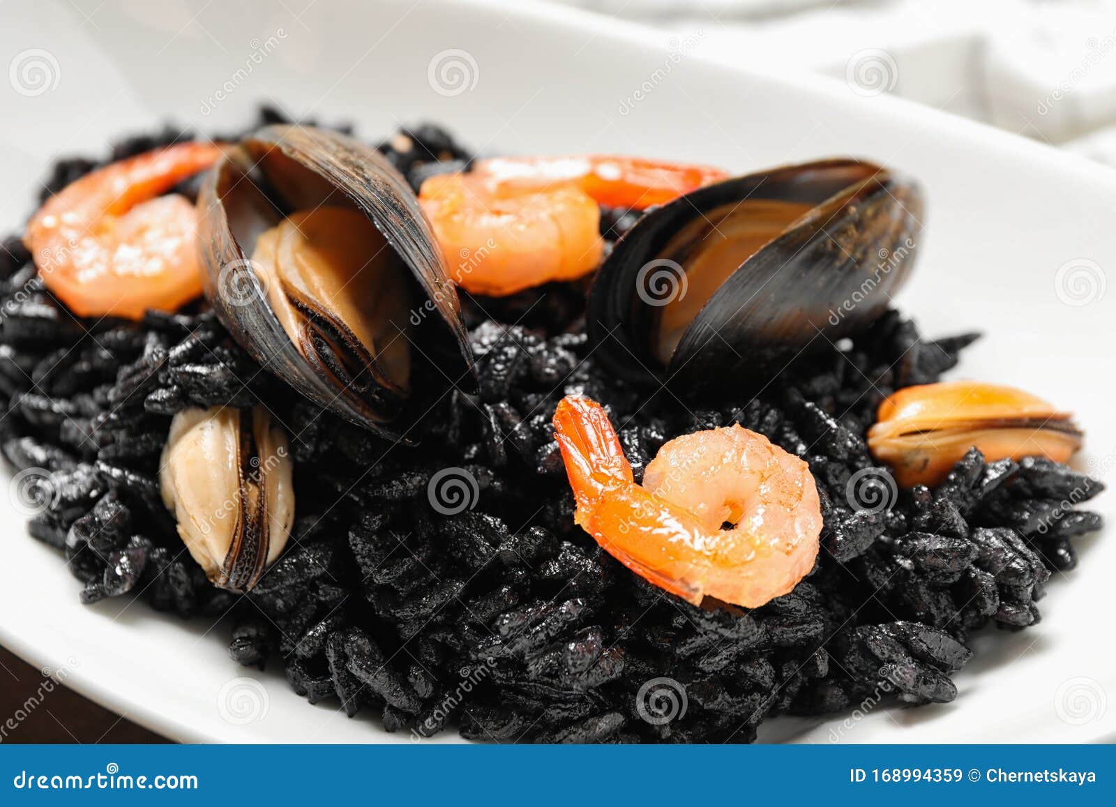 Delicious Black Risotto with Seafood in Plate, Closeup Stock Image ...