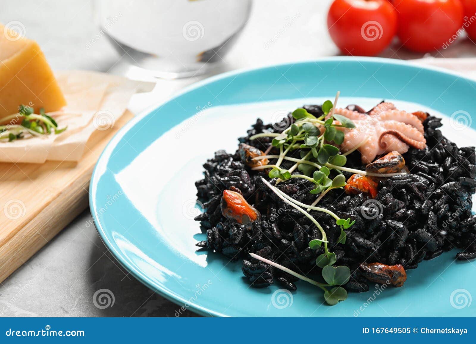 Delicious Black Risotto with Seafood on Table Stock Image - Image of ...