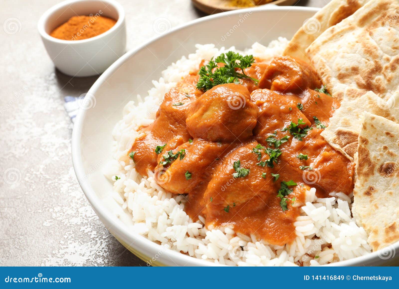 Delicious Butter Chicken with Rice in Plate on Table Stock Image ...