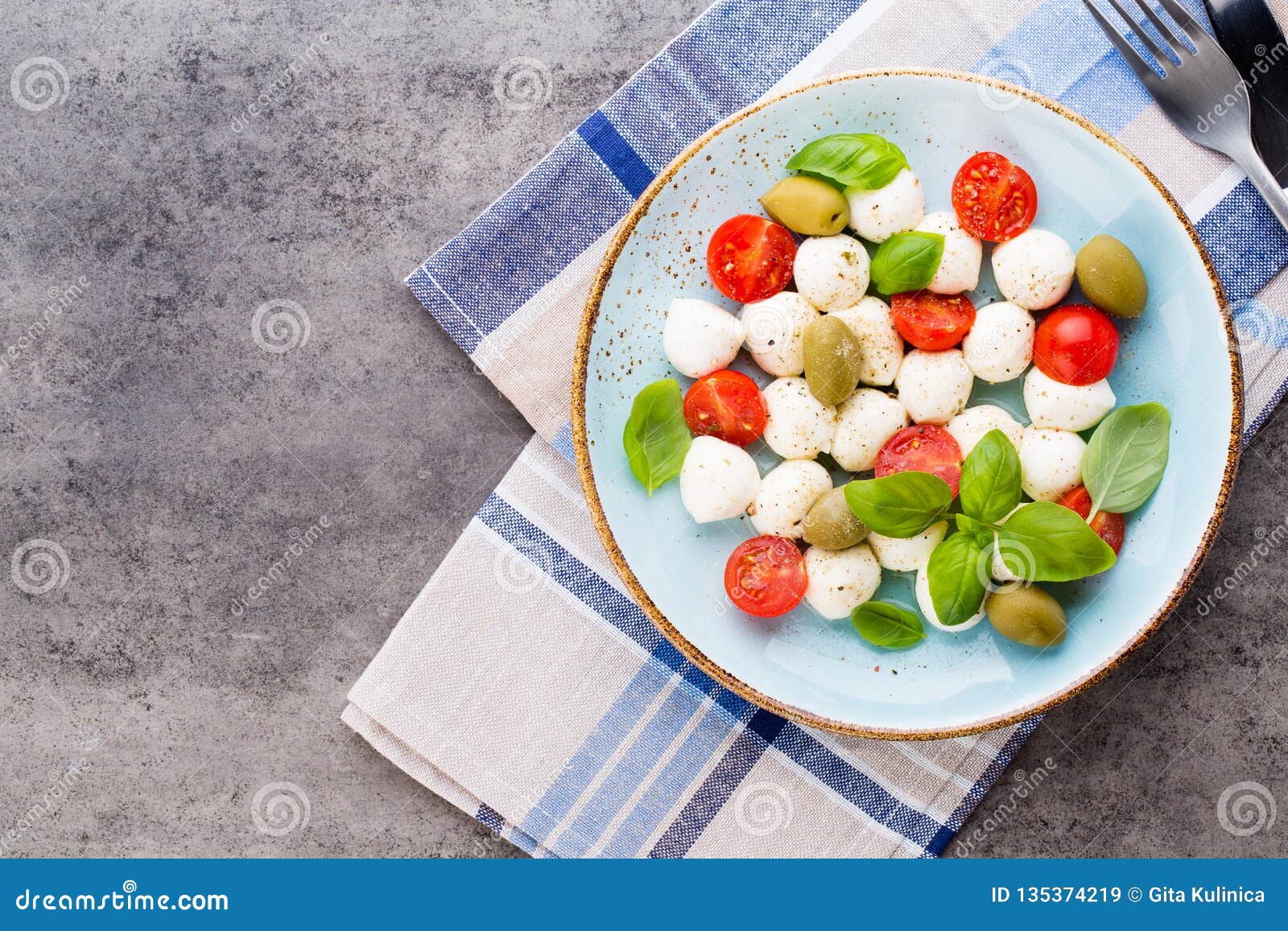 Delicious Caprese Salad With Ripe Cherry Tomatoes And Mini Mozzarella