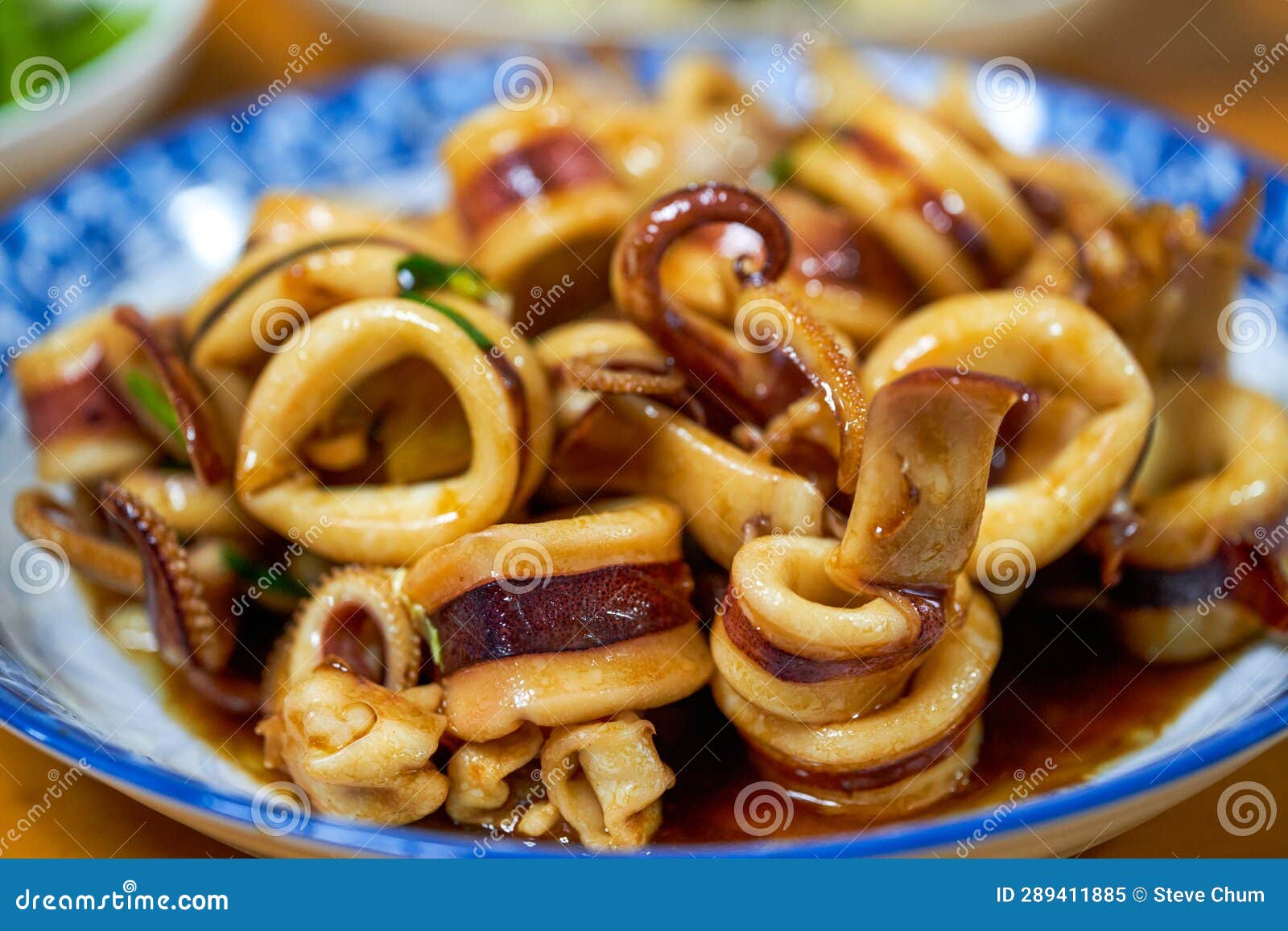 A Delicious Chinese Dish with Fried Fresh Squid in Sauce Stock Image ...