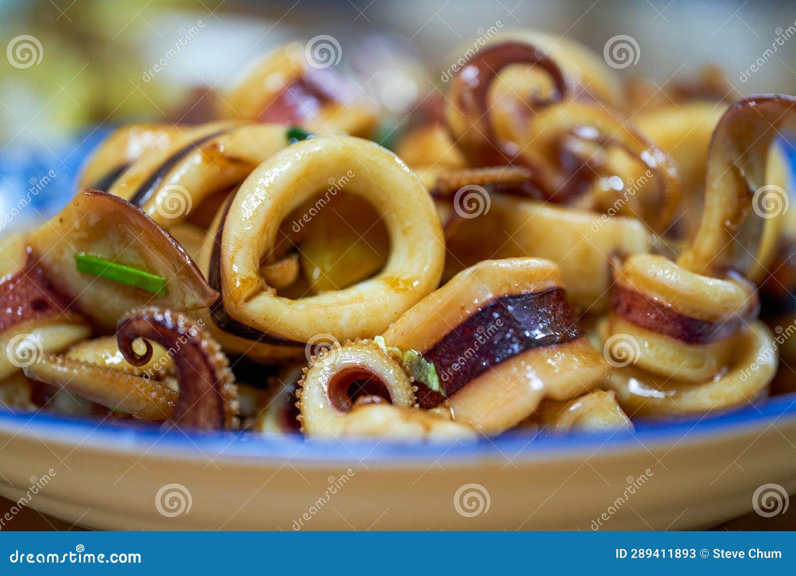 A Delicious Chinese Dish with Fried Fresh Squid in Sauce Stock Image ...